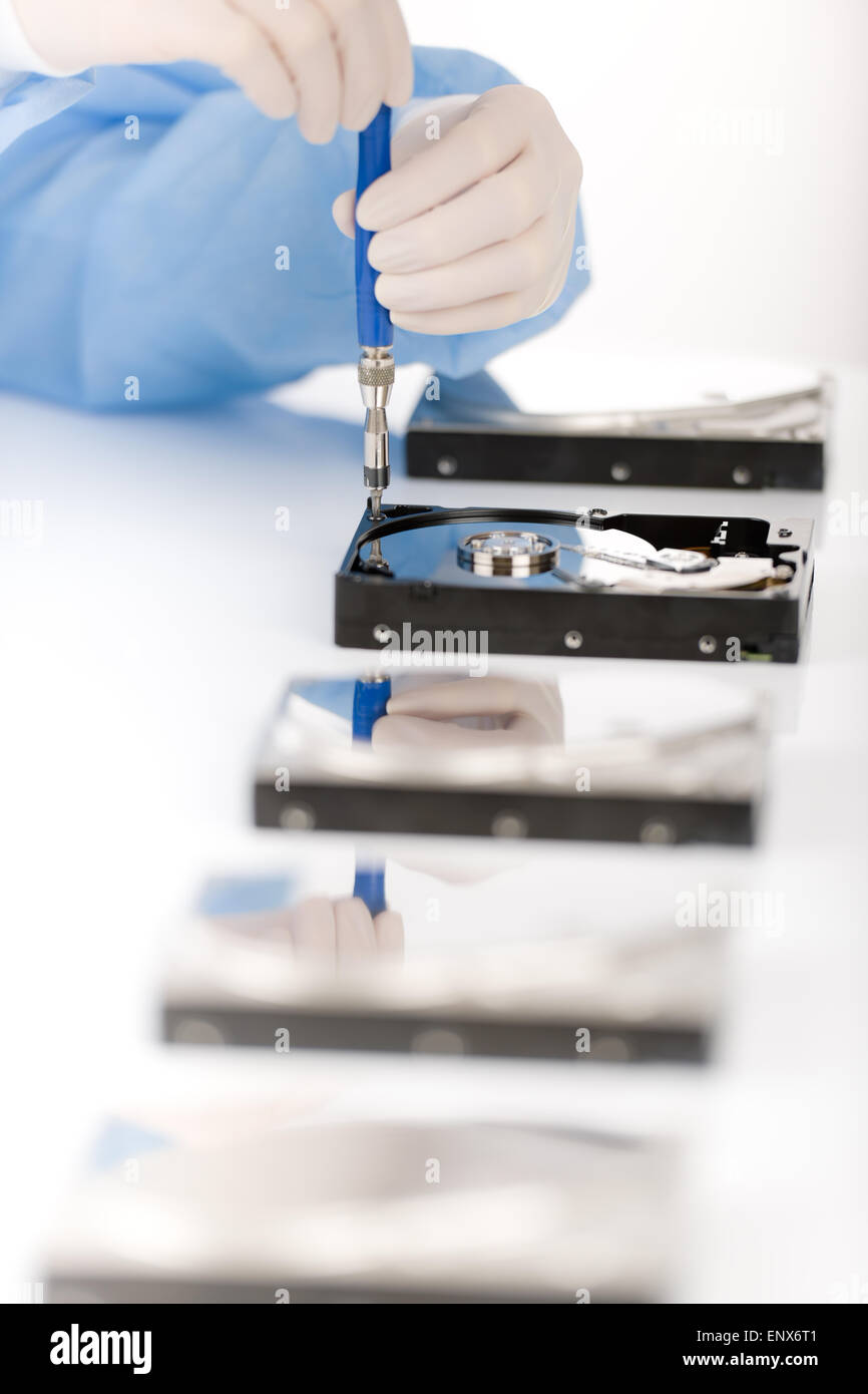Computer engineer repair hard disc defect, sterile Stock Photo - Alamy