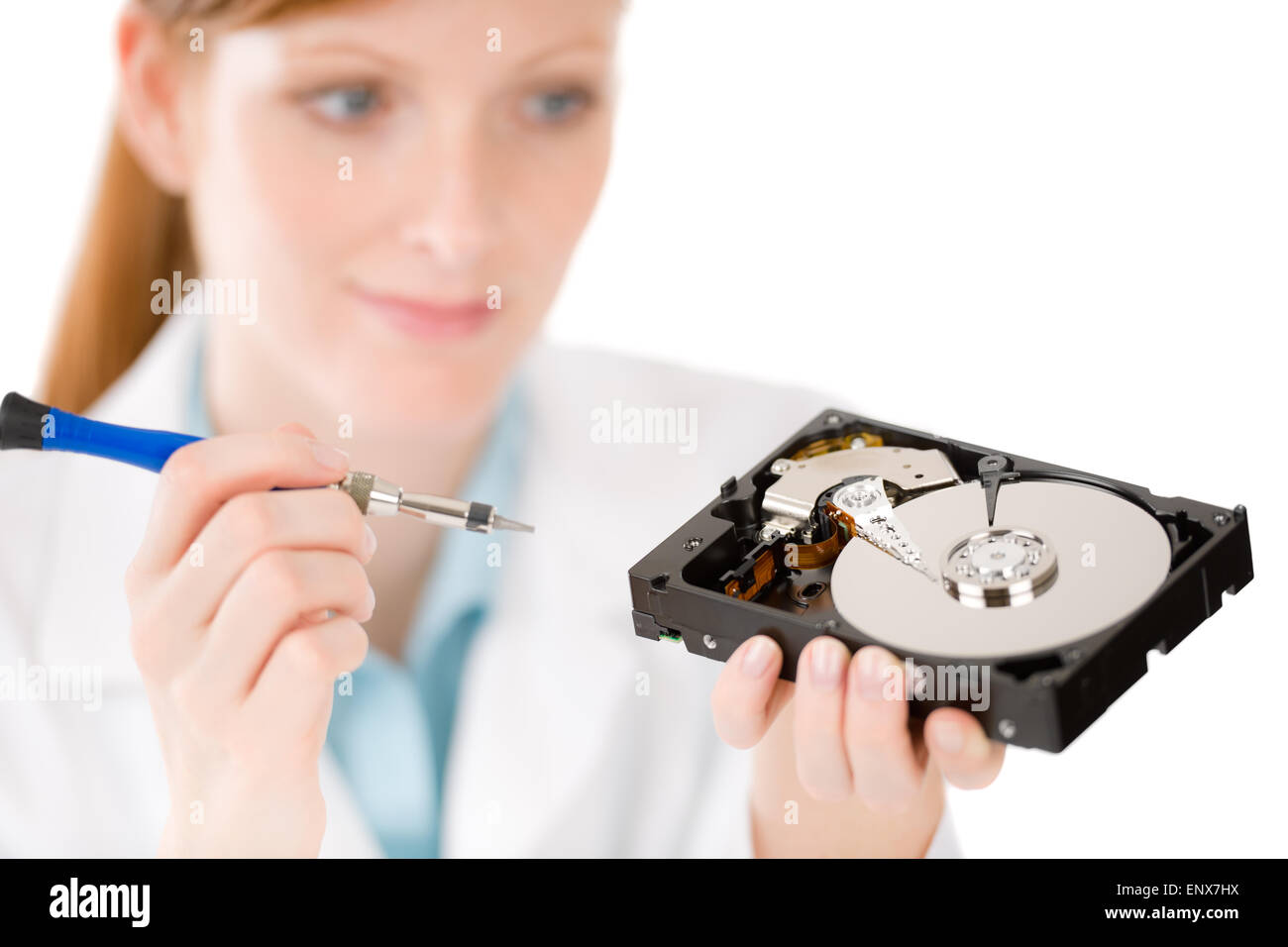 Female computer engineer - woman repair hard disc Stock Photo - Alamy