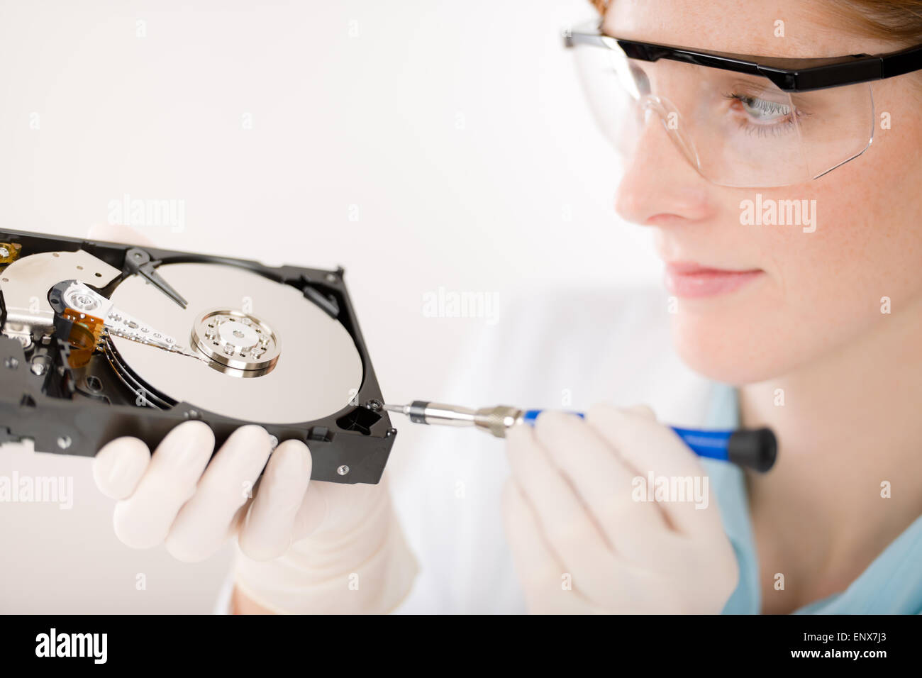 Female computer engineer - woman repair hard disc Stock Photo - Alamy