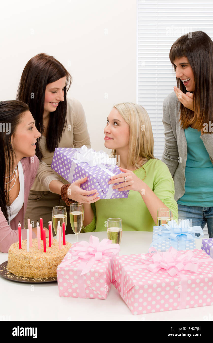 Birthday party - woman getting present with champagne Stock Photo - Alamy