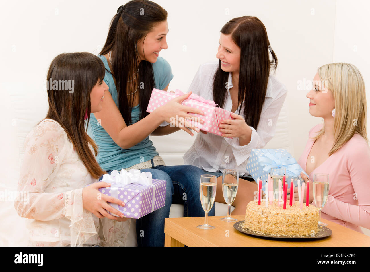 Birthday party - woman getting present, surprise Stock Photo - Alamy
