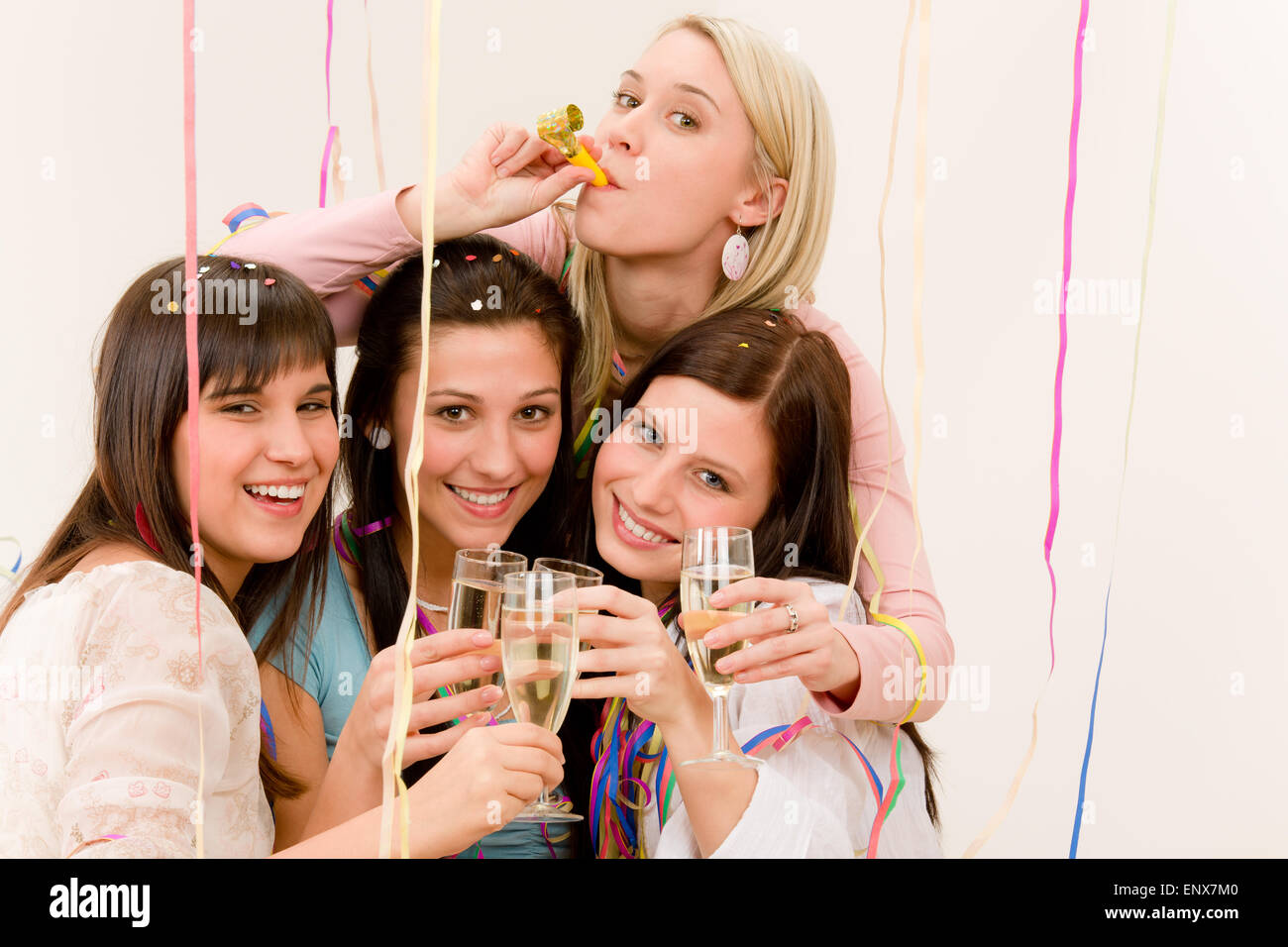 Birthday party celebration - four woman with confetti have fun Stock ...