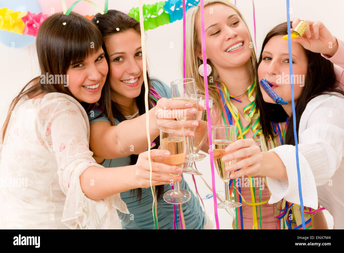 Birthday party celebration - four woman with confetti have fun Stock ...