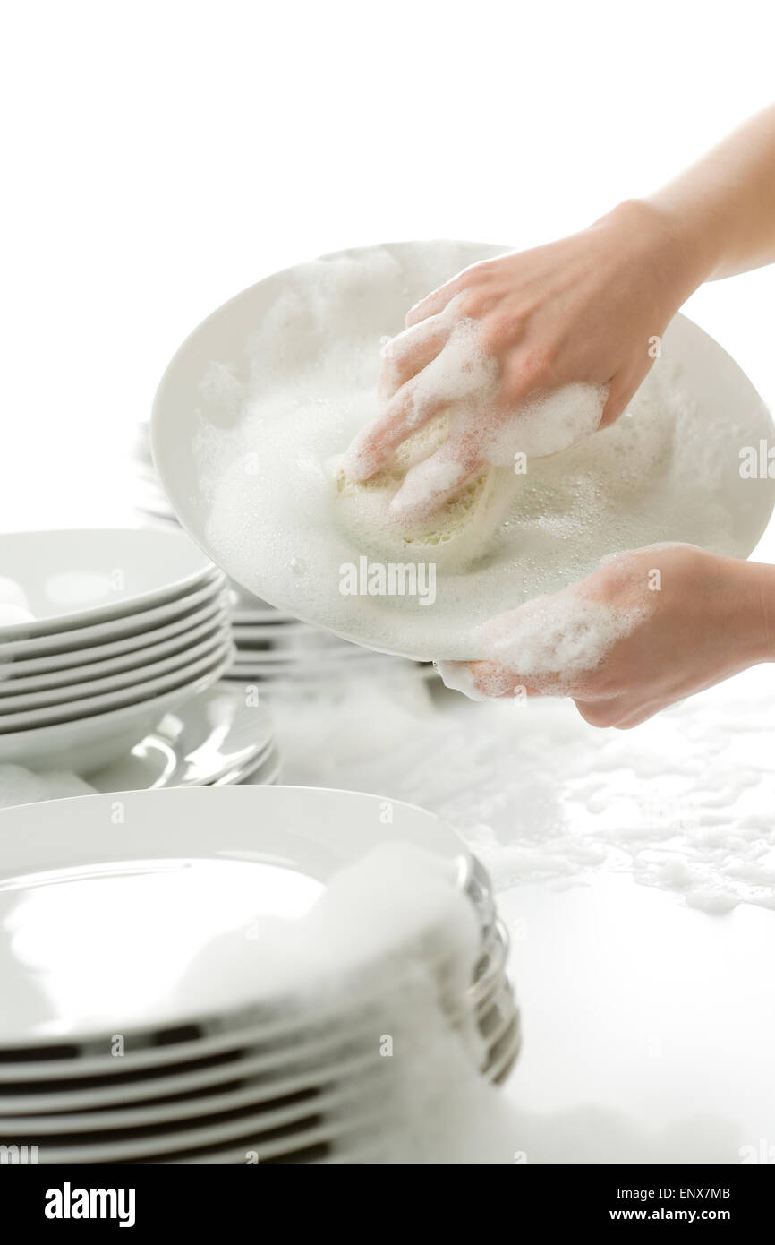Washing dishes - hands with gloves in kitchen Stock Photo - Alamy