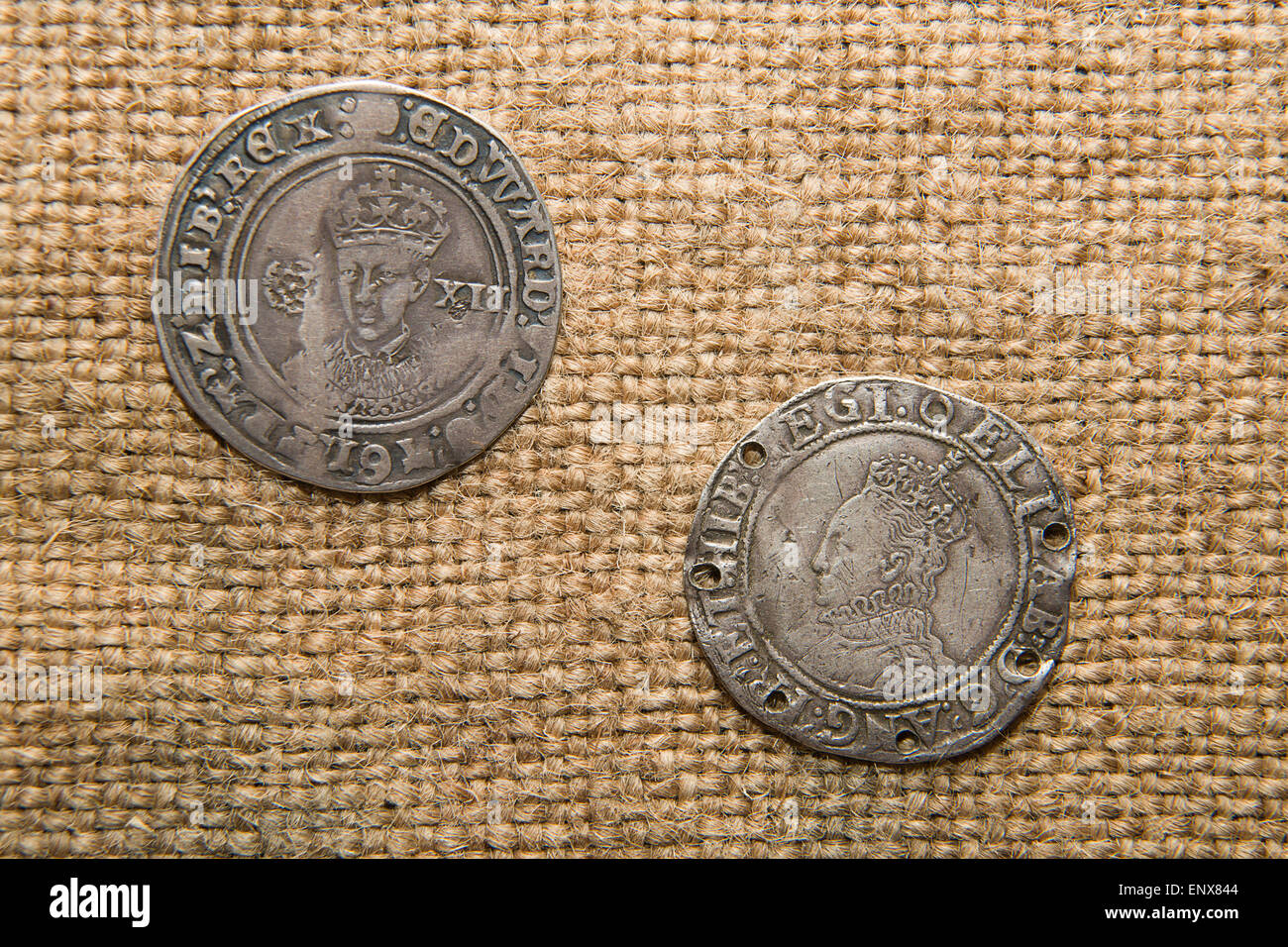 A lot of old England silver coins with portraits of kings on the old ...