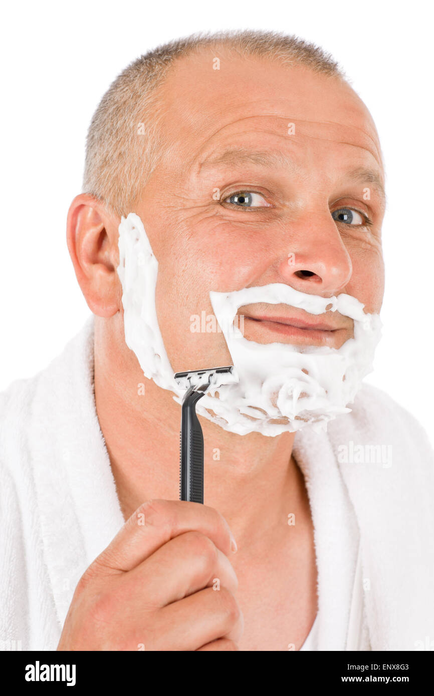 Male cosmetics - Mature man shaving his beard Stock Photo - Alamy