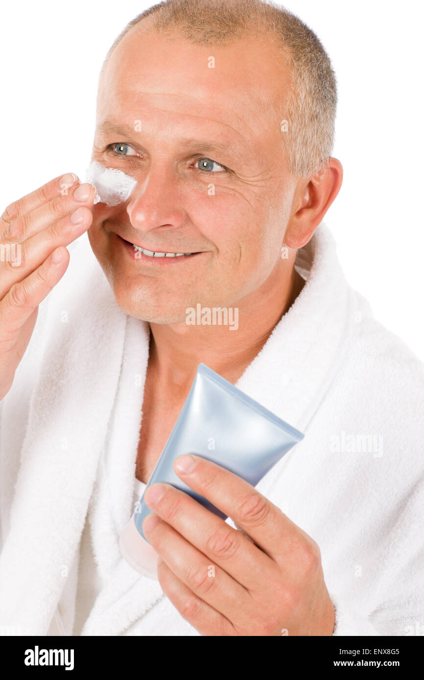 Male cosmetics - senior man apply facial cream Stock Photo - Alamy