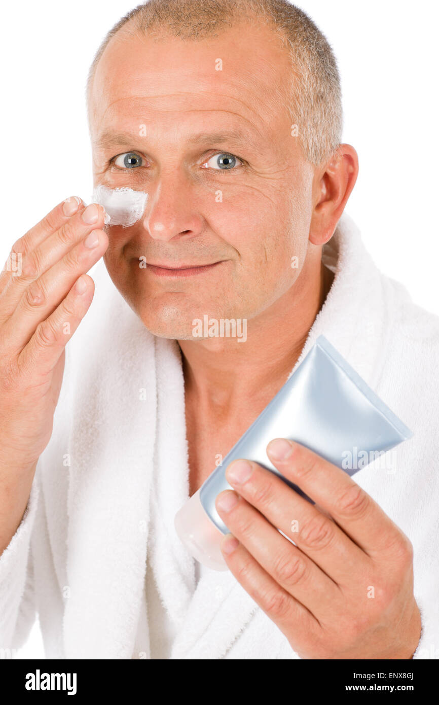 Male cosmetics - senior man apply facial cream Stock Photo - Alamy