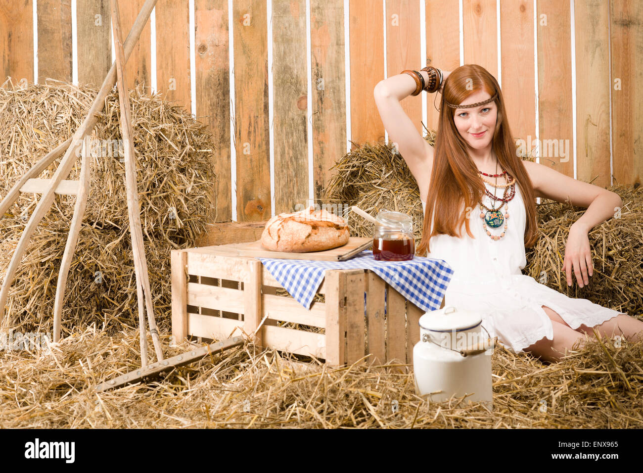 Redhead hippie young woman have breakfast in barn Stock Photo - Alamy