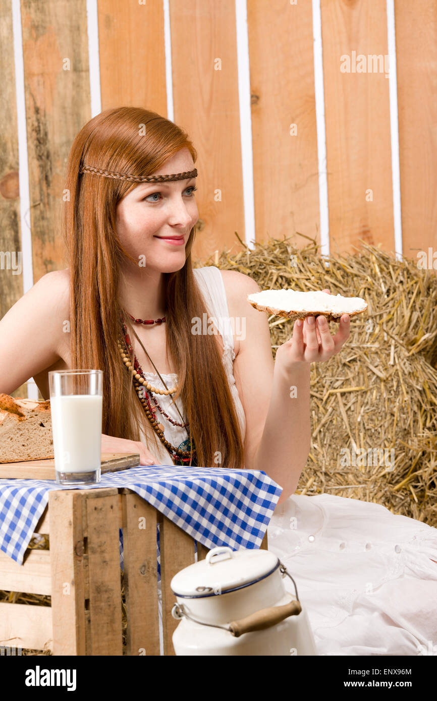 Redhead hippie young woman have breakfast in barn Stock Photo - Alamy