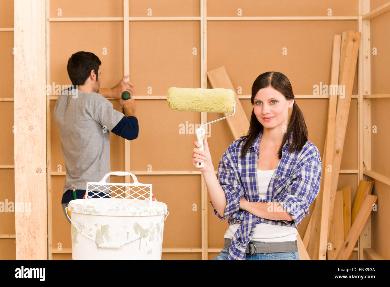 Home improvement: young couple fixing new house Stock Photo - Alamy