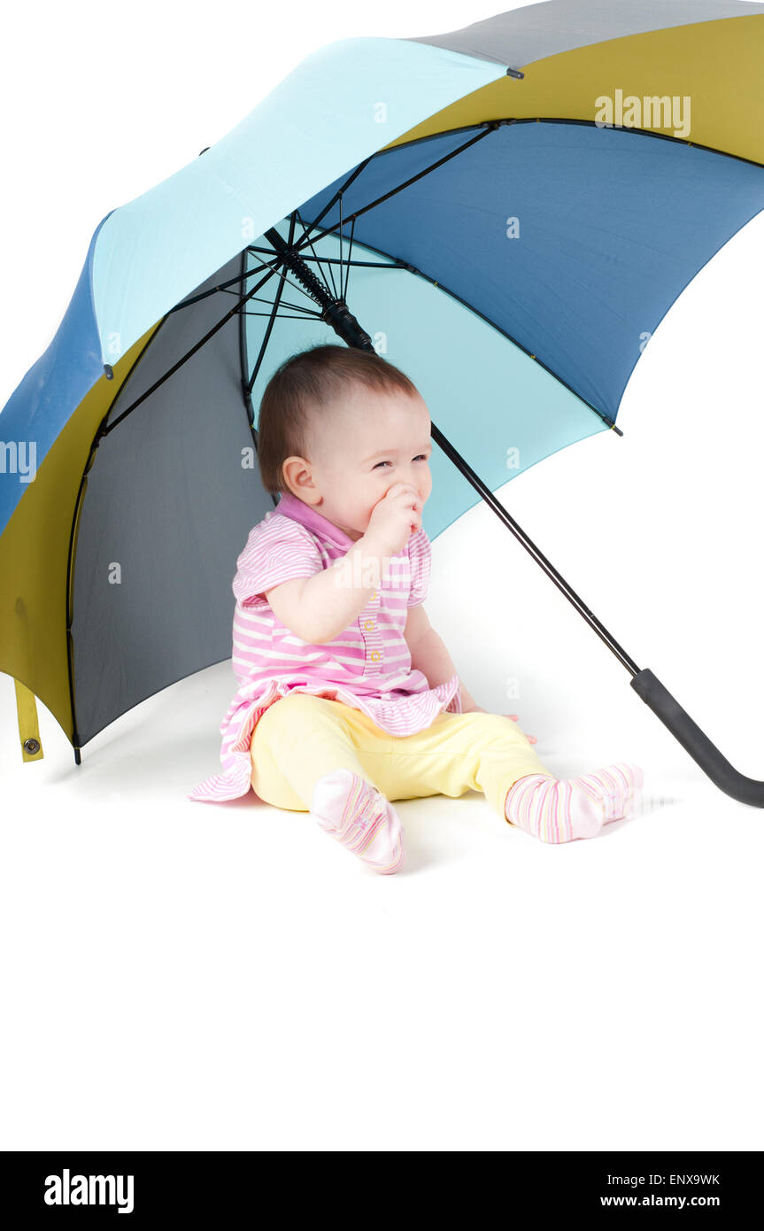 Cute baby girl under umbrella Stock Photo - Alamy