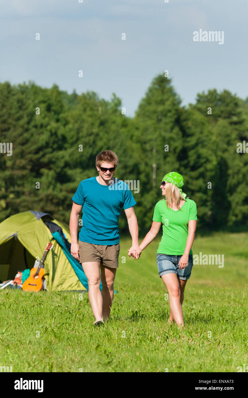 Young camping couple hold hands summer countryside Stock Photo - Alamy