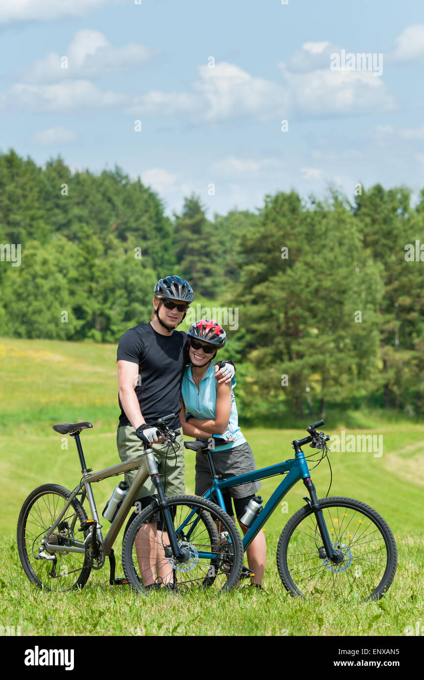 Sport mountain biking couple relax in meadows Stock Photo - Alamy