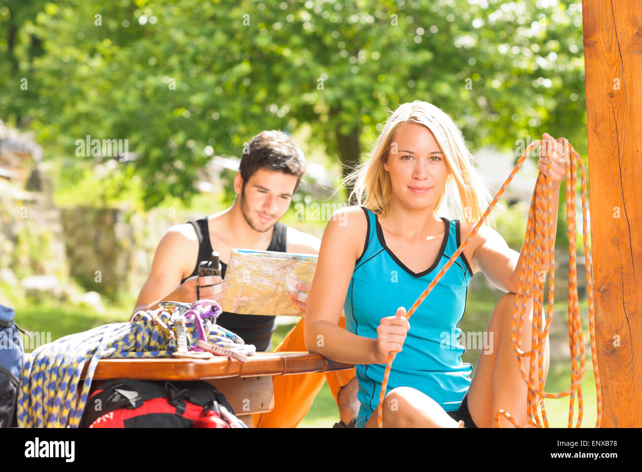 Active young woman climbing rope relax terrace Stock Photo - Alamy