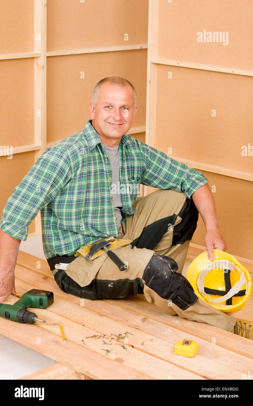 Handyman home improvement wooden floor screwdriver Stock Photo - Alamy