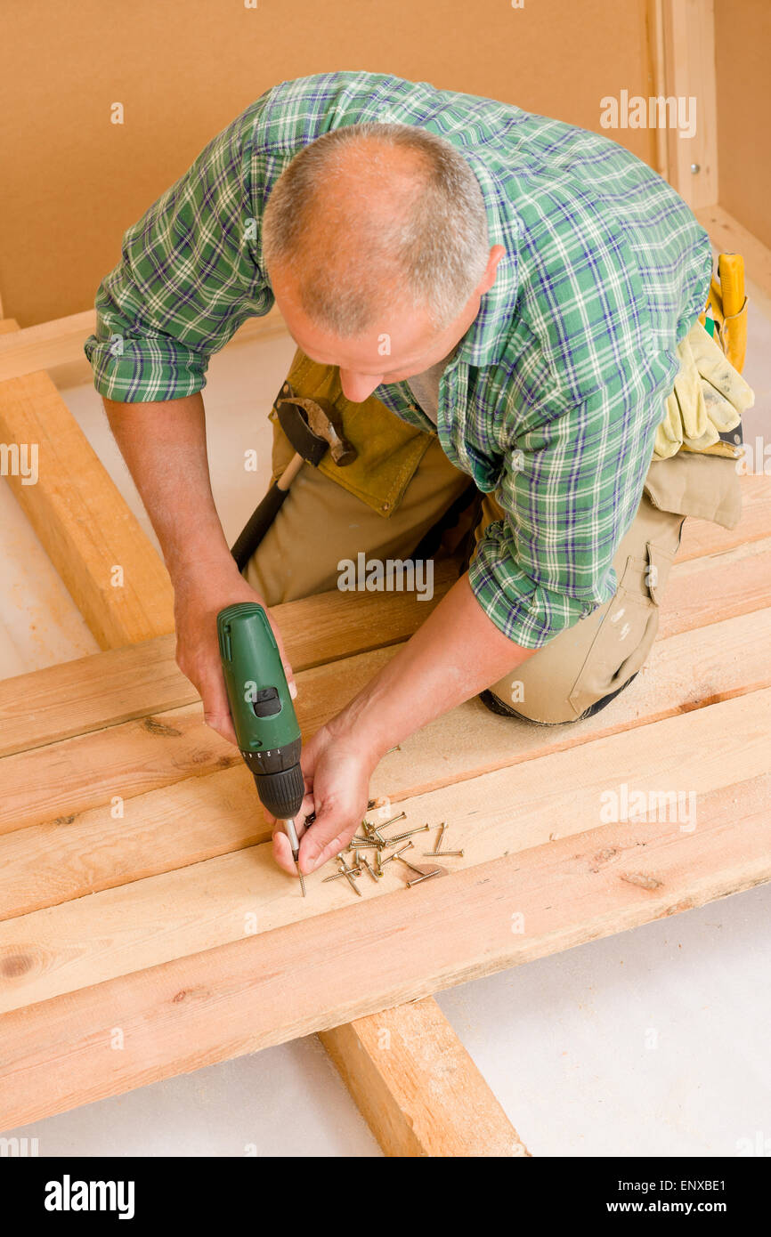 Handyman home improvement wooden floor screwdriver Stock Photo - Alamy