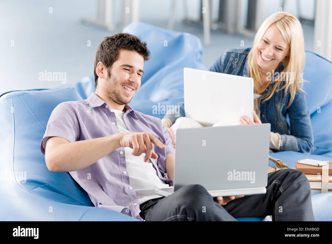Young students at high-school pointing at laptop Stock Photo - Alamy