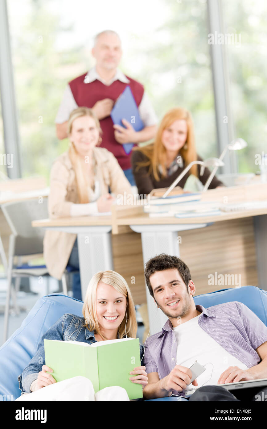 High-school students with mature professor listen music Stock Photo - Alamy