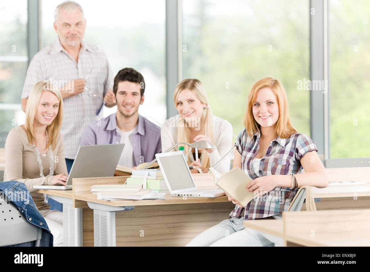 Group of high-school students with mature professor Stock Photo - Alamy