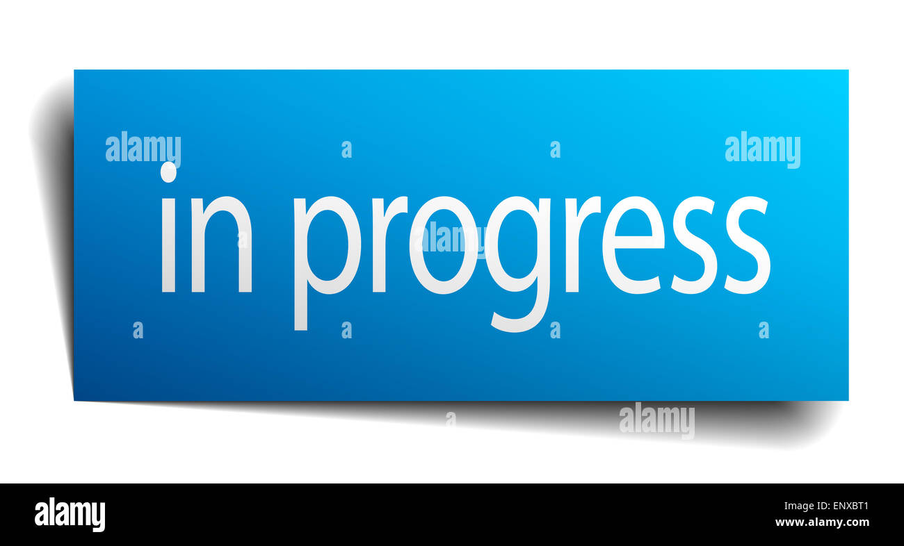 in progress blue paper sign isolated on white Stock Photo - Alamy