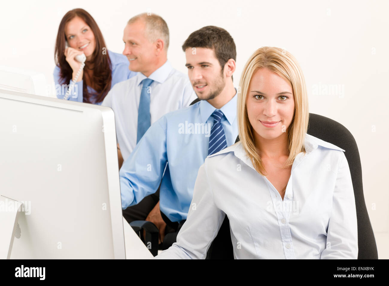 Business team happy sit in line behind table Stock Photo - Alamy