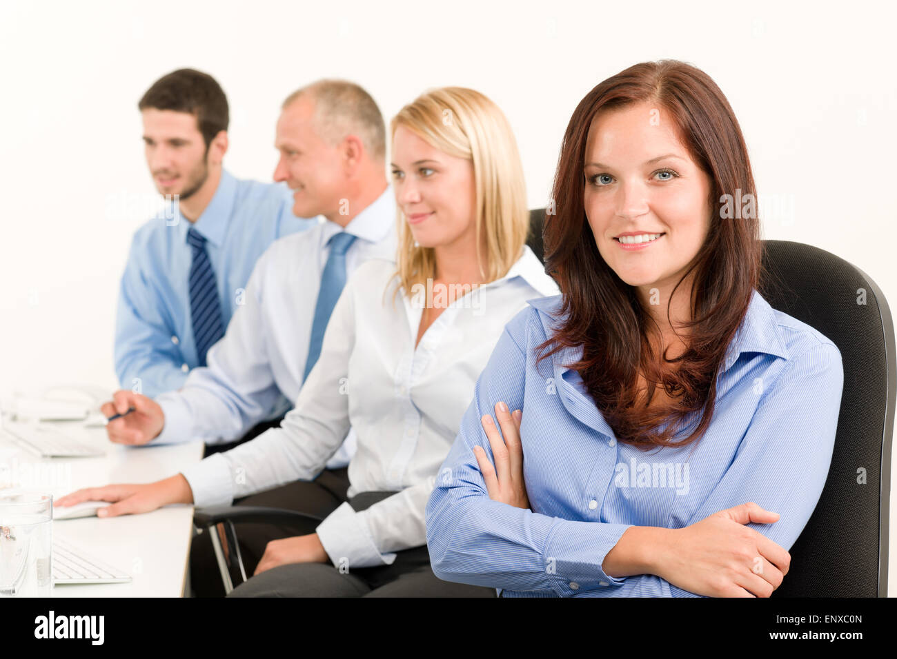Business team happy sit in line behind table Stock Photo - Alamy