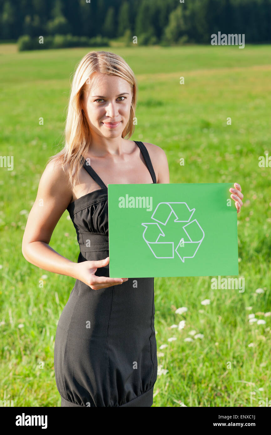 Green energy young businesswoman hold recycle sign Stock Photo - Alamy