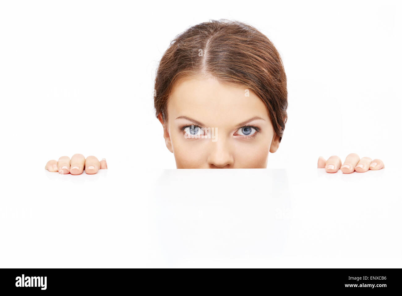 Beautiful girl looks out from under something Stock Photo - Alamy