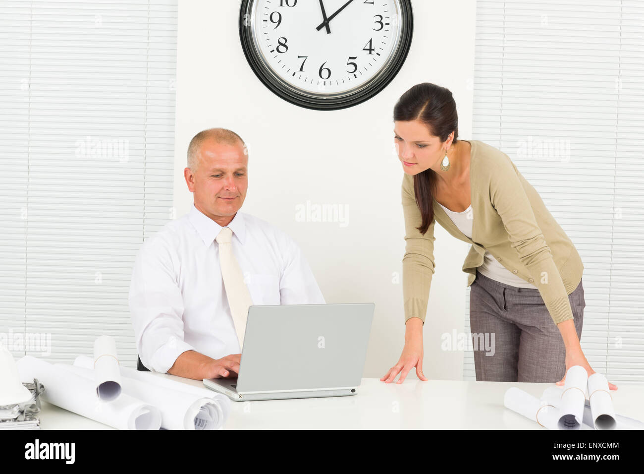Professional architect people behind office table Stock Photo - Alamy