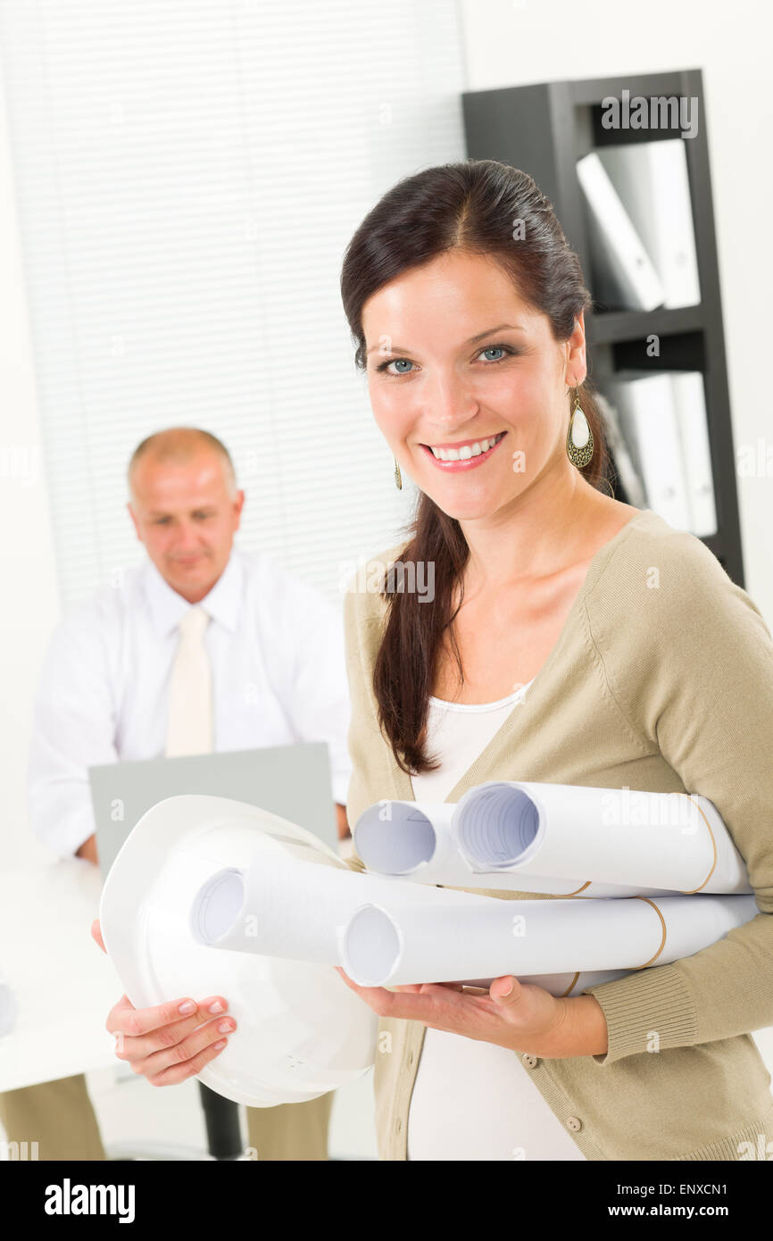 Professional architect woman with blueprint office Stock Photo - Alamy