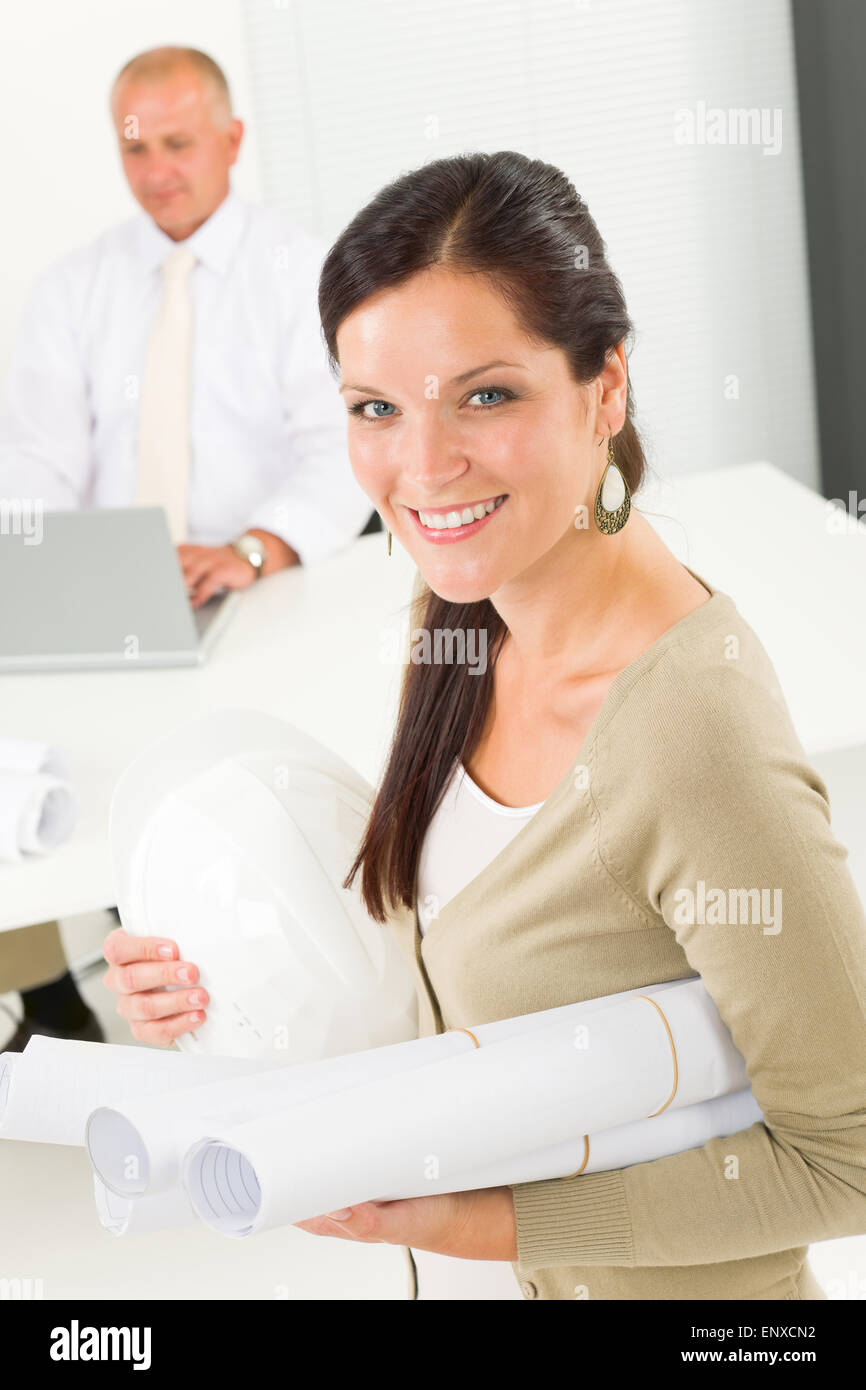 Professional architect woman with blueprint office Stock Photo - Alamy