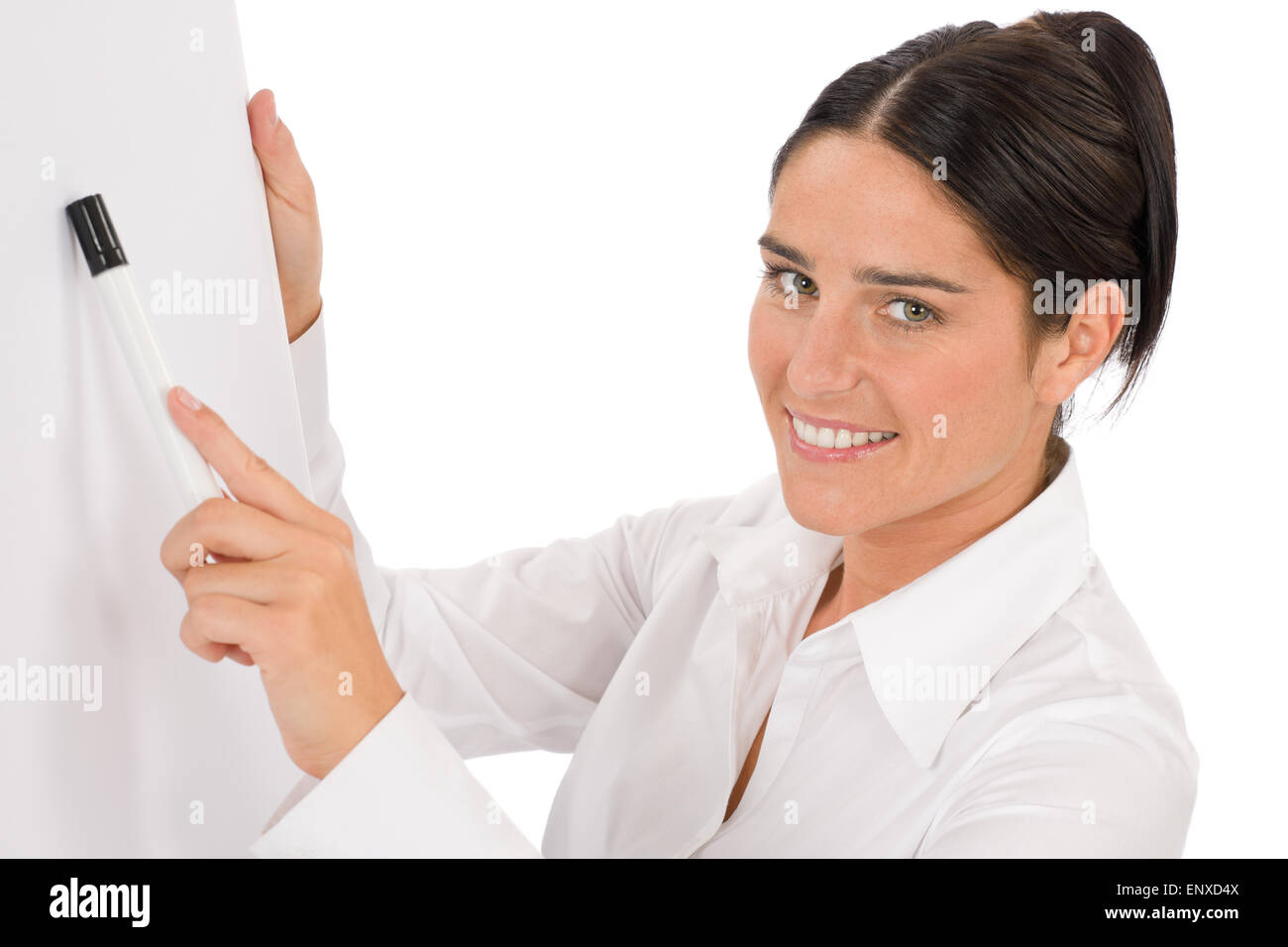 Happy businesswoman pointing at empty flip chart Stock Photo - Alamy Happy businesswoman pointing at empty flip chart Stock Photo - Alamy