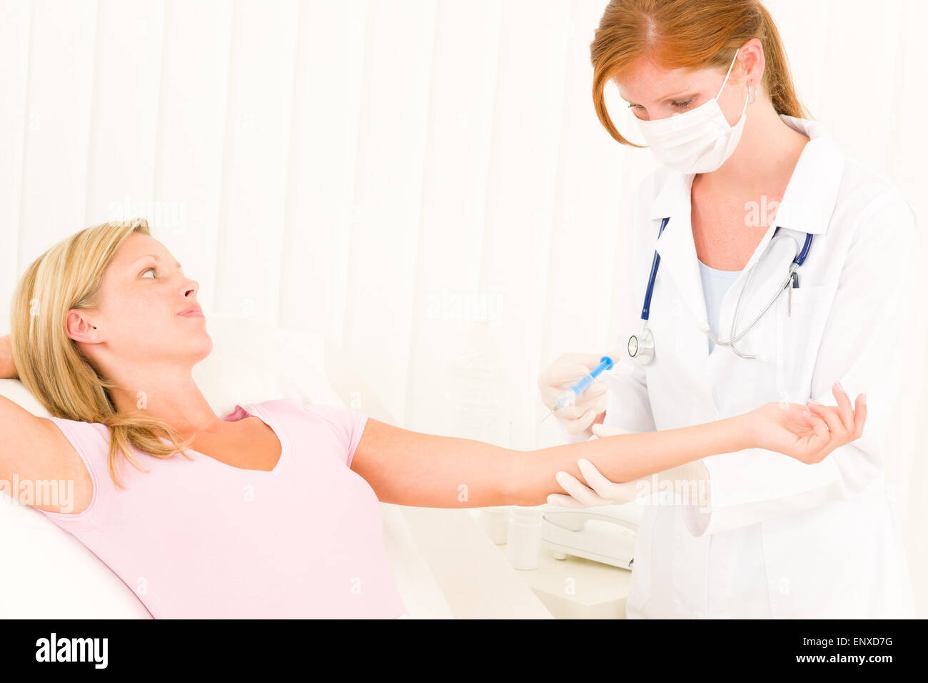 Medical doctor apply injection to woman patient Stock Photo - Alamy