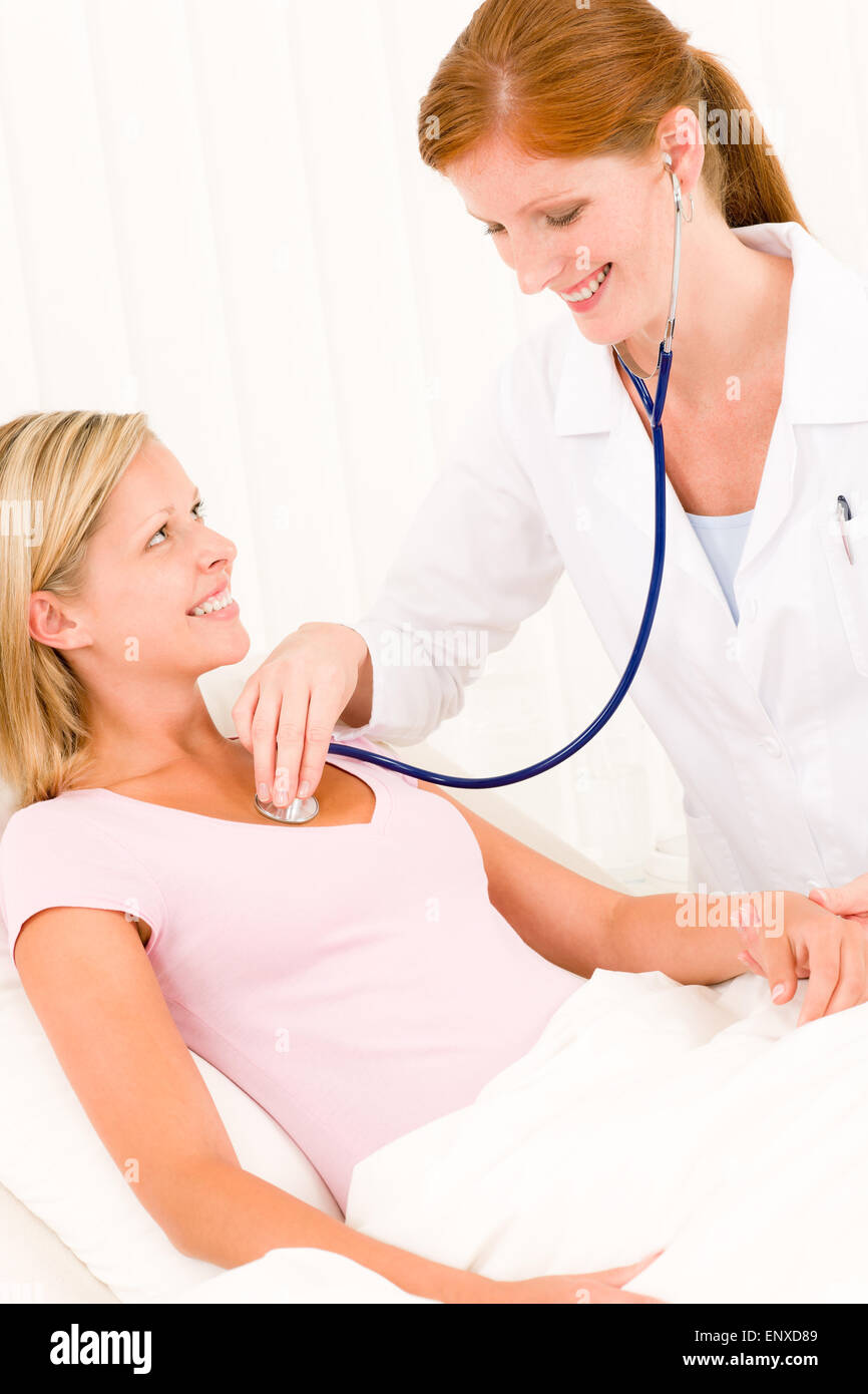 Medical doctor stethoscope examine woman patient Stock Photo - Alamy