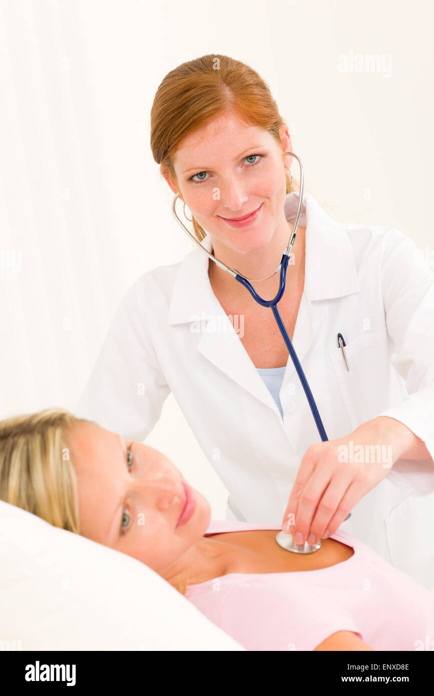 Medical doctor stethoscope examine woman patient Stock Photo - Alamy