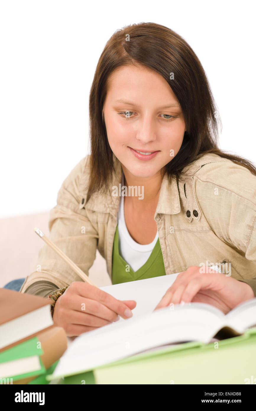 Student teenager girl write homework with book Stock Photo - Alamy