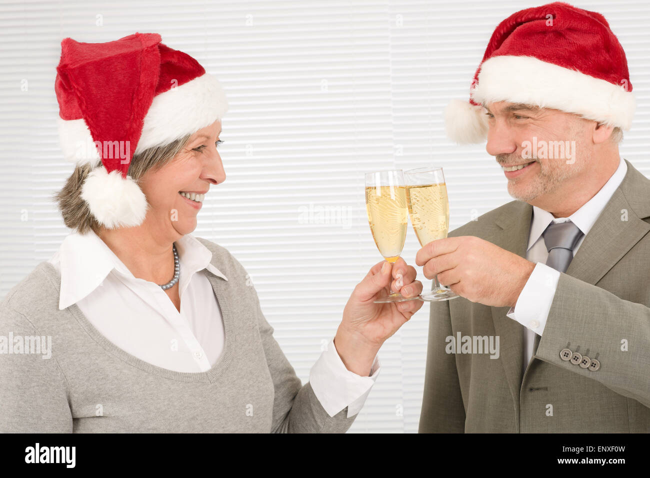 Xmas business toast senior colleagues celebrate Stock Photo - Alamy