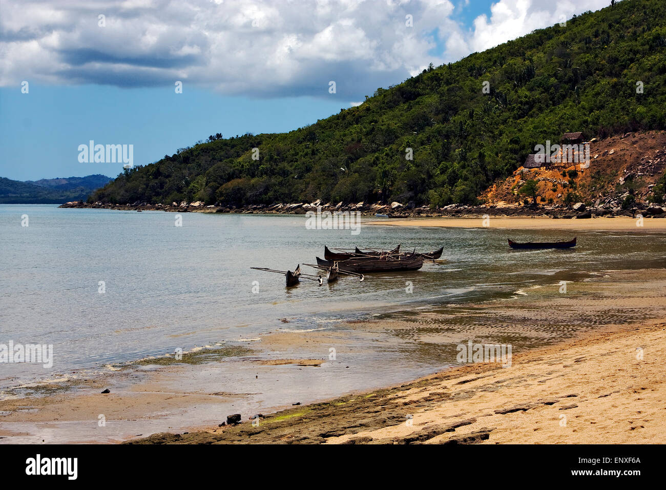 house tree boat sand lagoon tropical and coastline in madagascar nosy ...