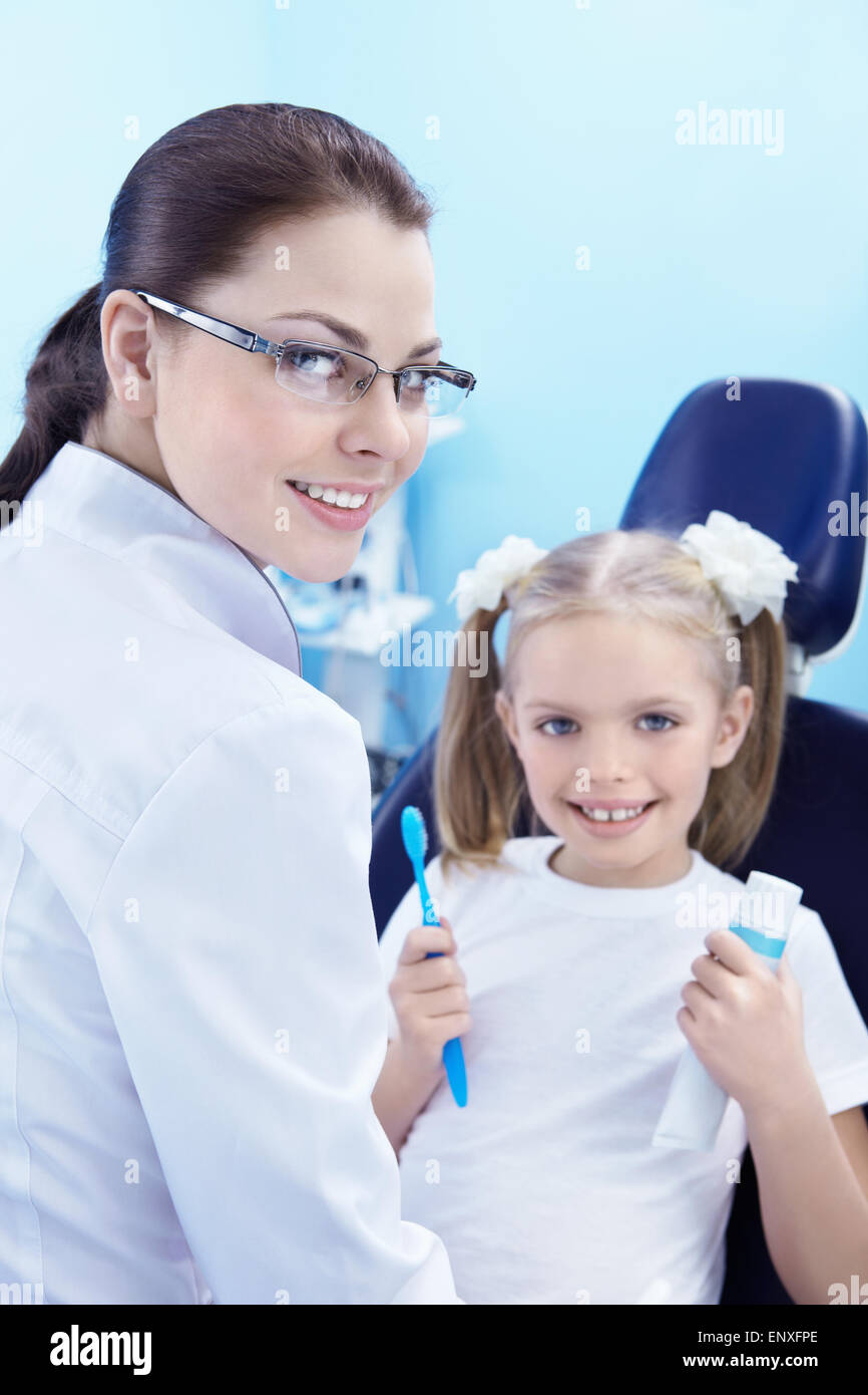 A child in a dental chair with a toothbrush and toothpaste Stock Photo ...