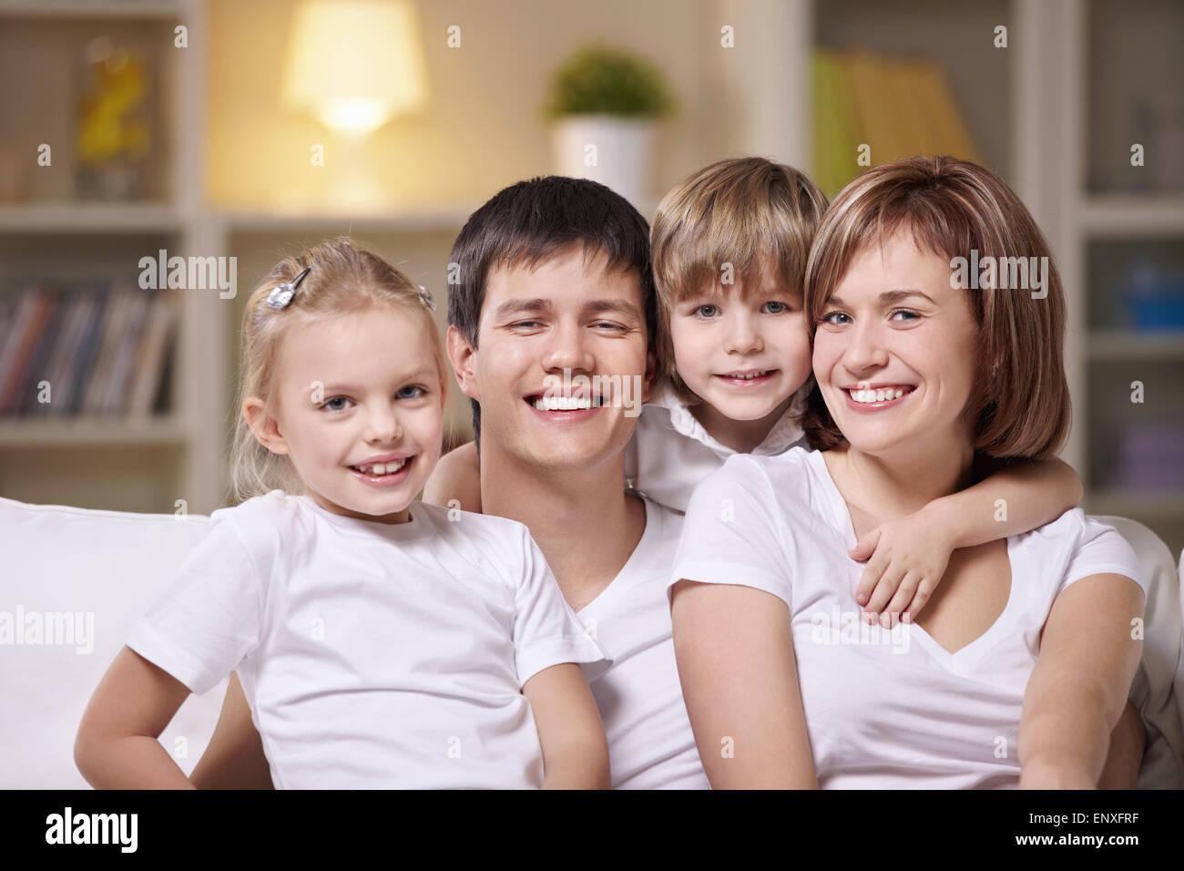A happy family with children at home in the evening Stock Photo - Alamy