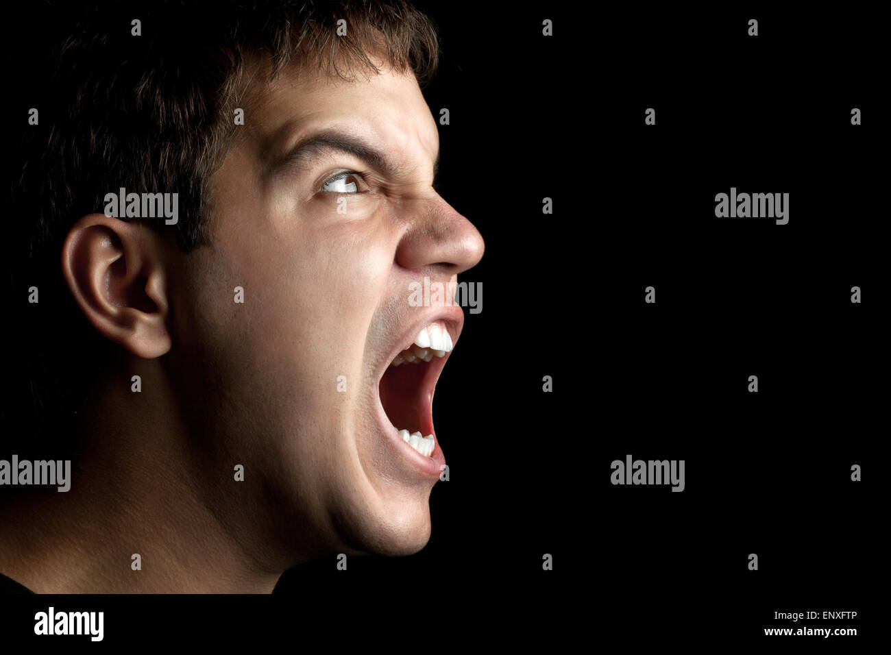 portrait of young angry man sreaming isolated Stock Photo - Alamy