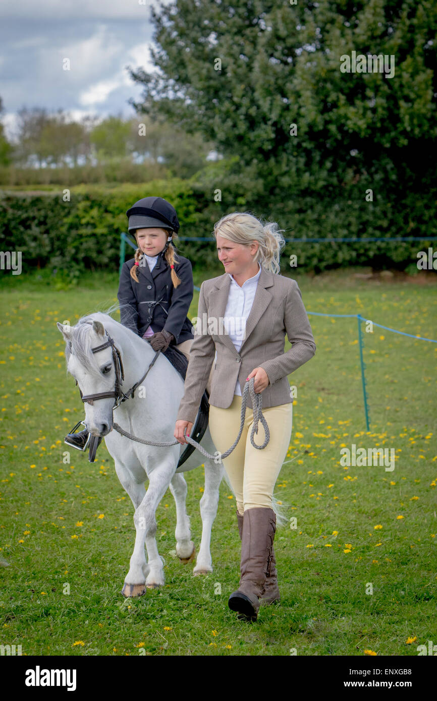 Riders and their horses take part in a local Riding Club Show held at ...
