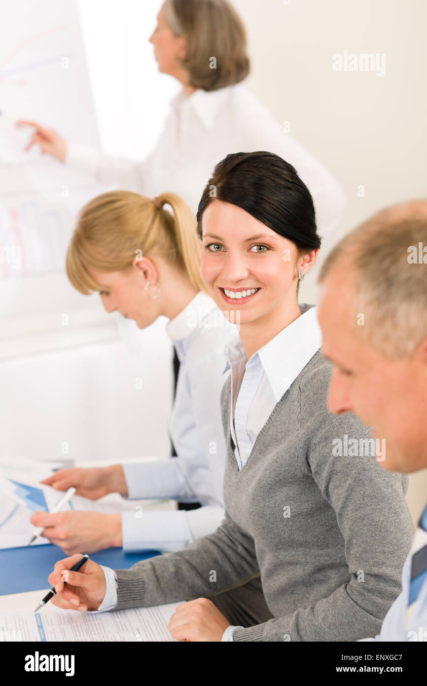 Giving presentation young woman during meeting Stock Photo - Alamy
