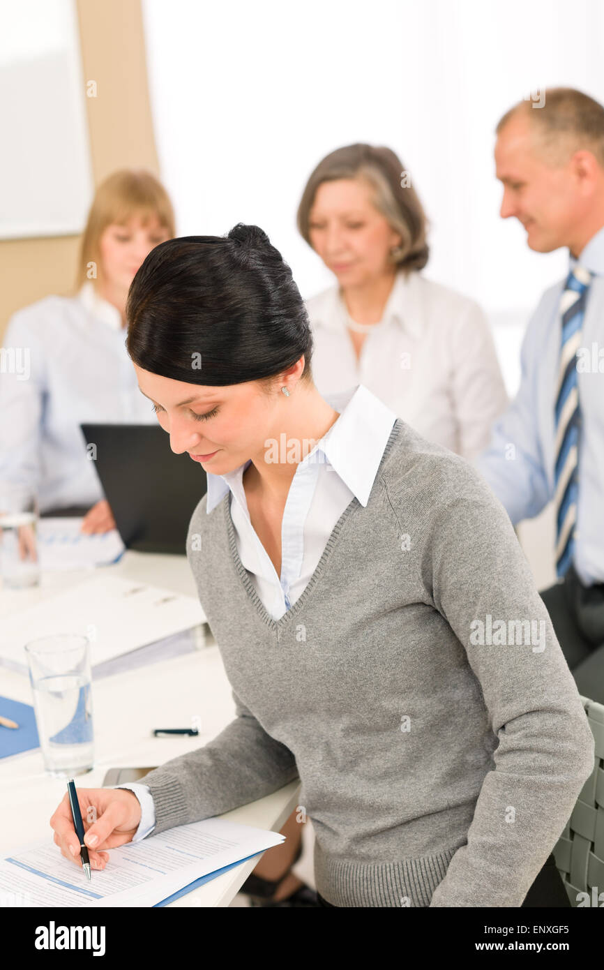 Young executive woman take notes during meeting Stock Photo - Alamy