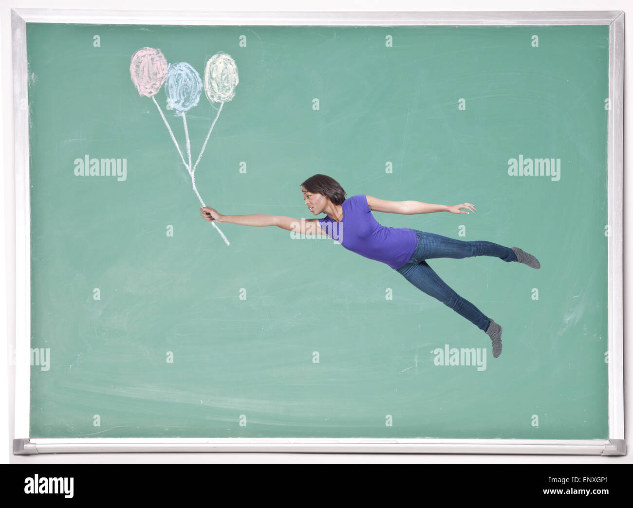 Woman Floating with Chalk Balloons Stock Photo - Alamy