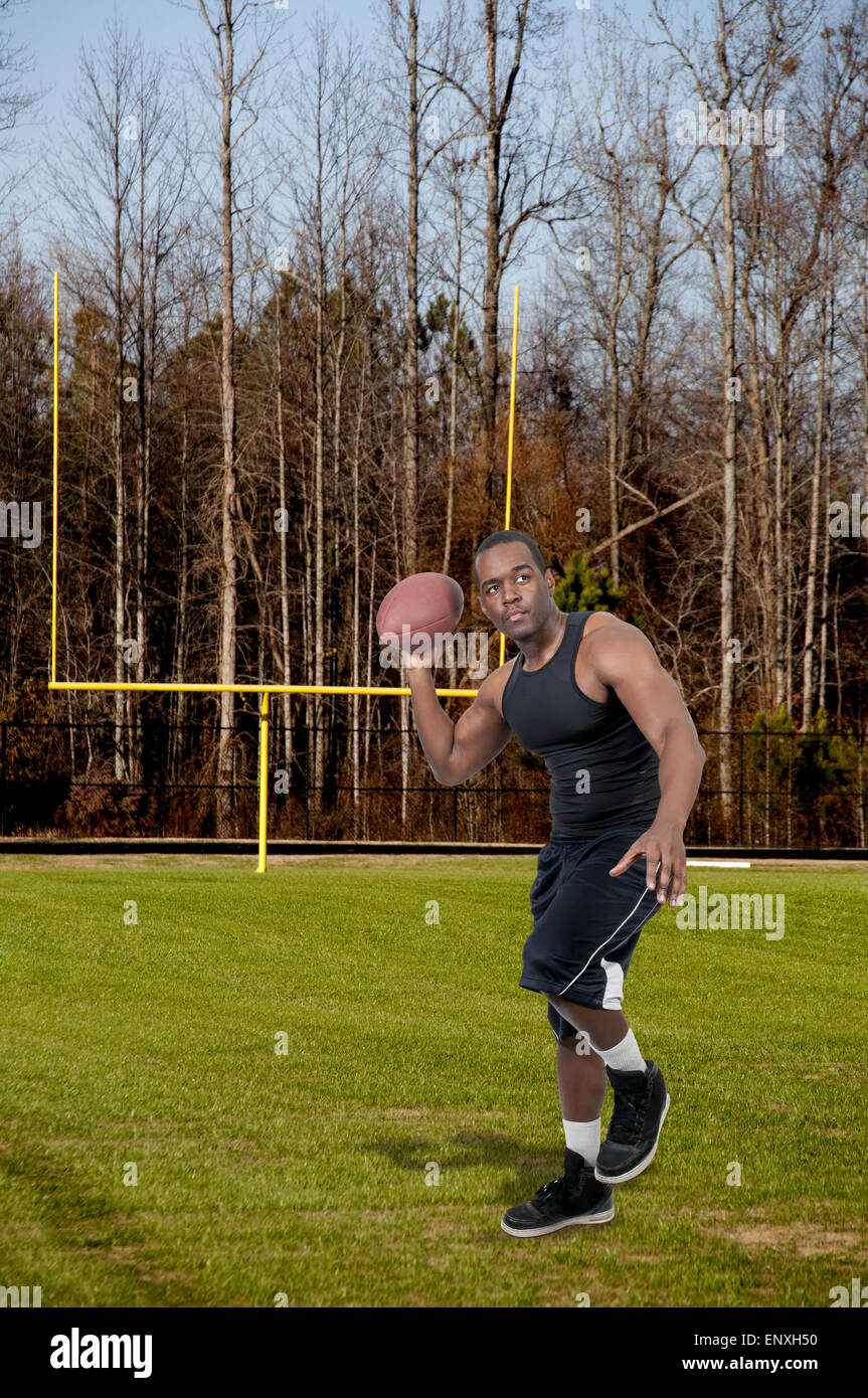 Black Man Playing Football Stock Photo - Alamy