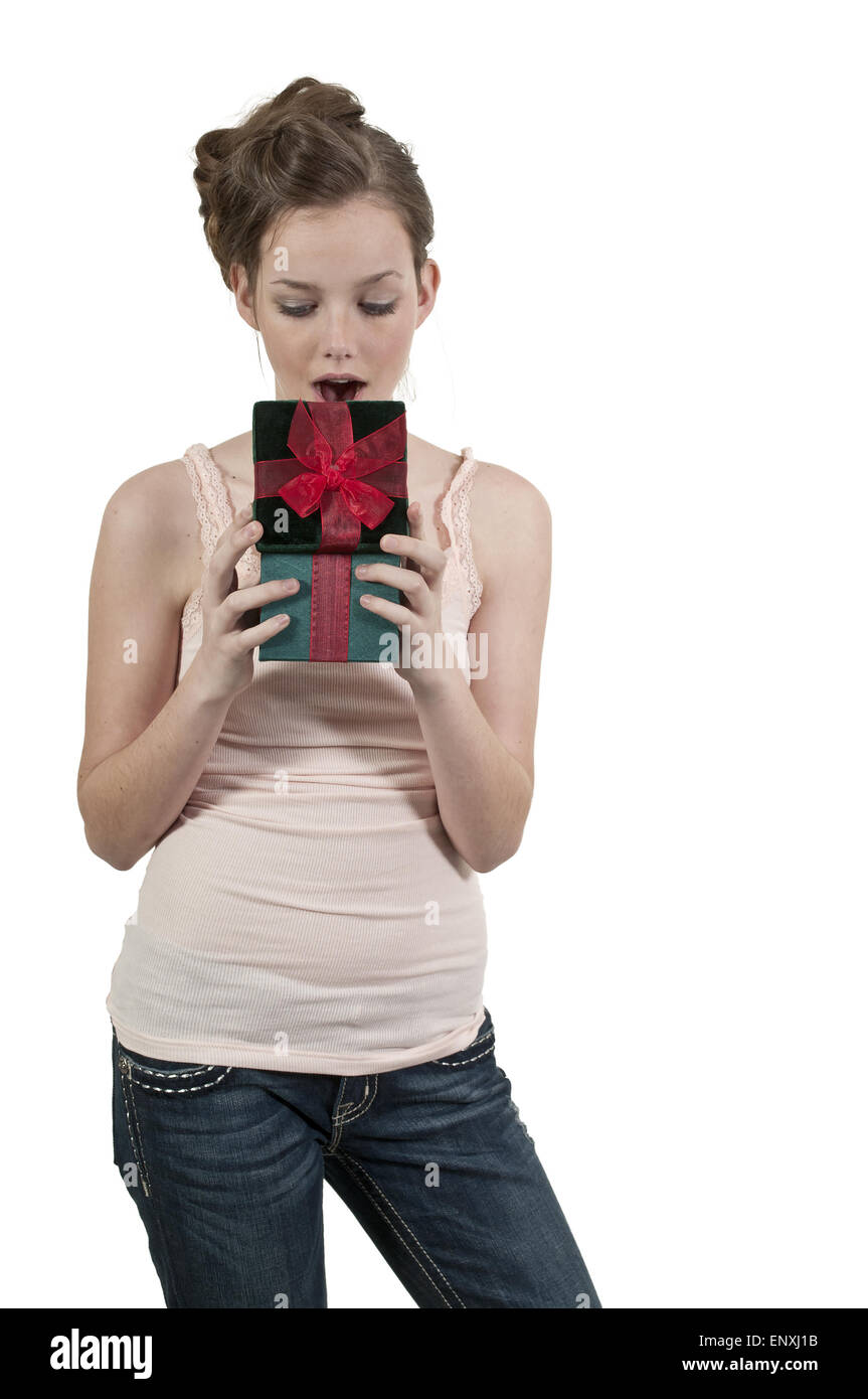 A beautiful woman opening a present Stock Photo - Alamy