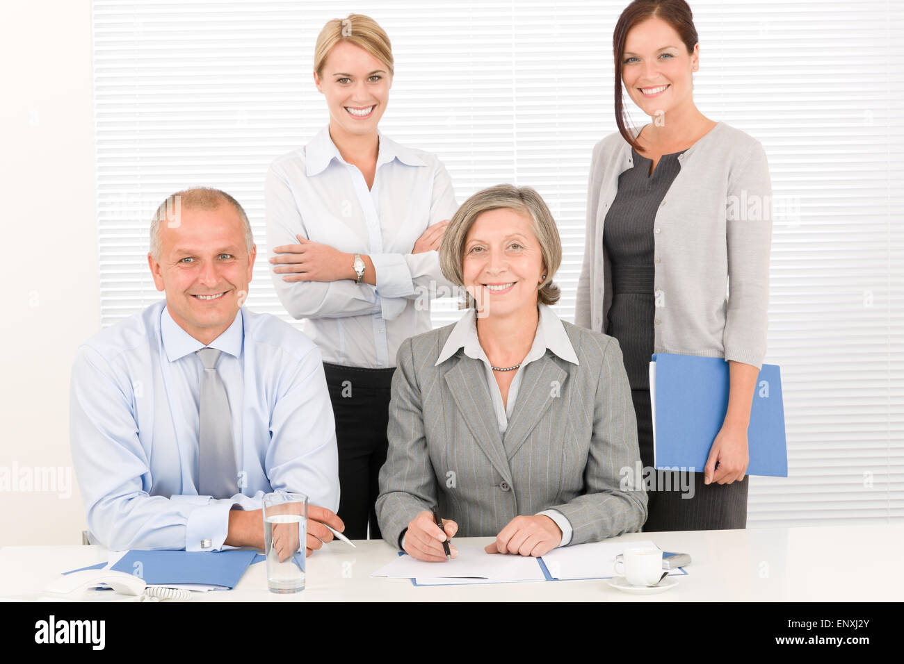Business team pretty businesswomen with colleagues Stock Photo - Alamy