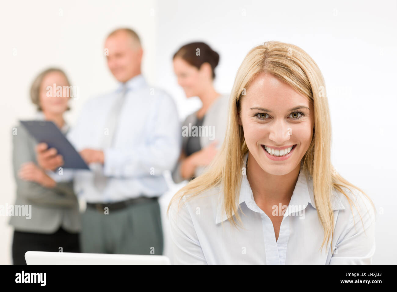 Business woman pretty with colleagues discussing Stock Photo - Alamy